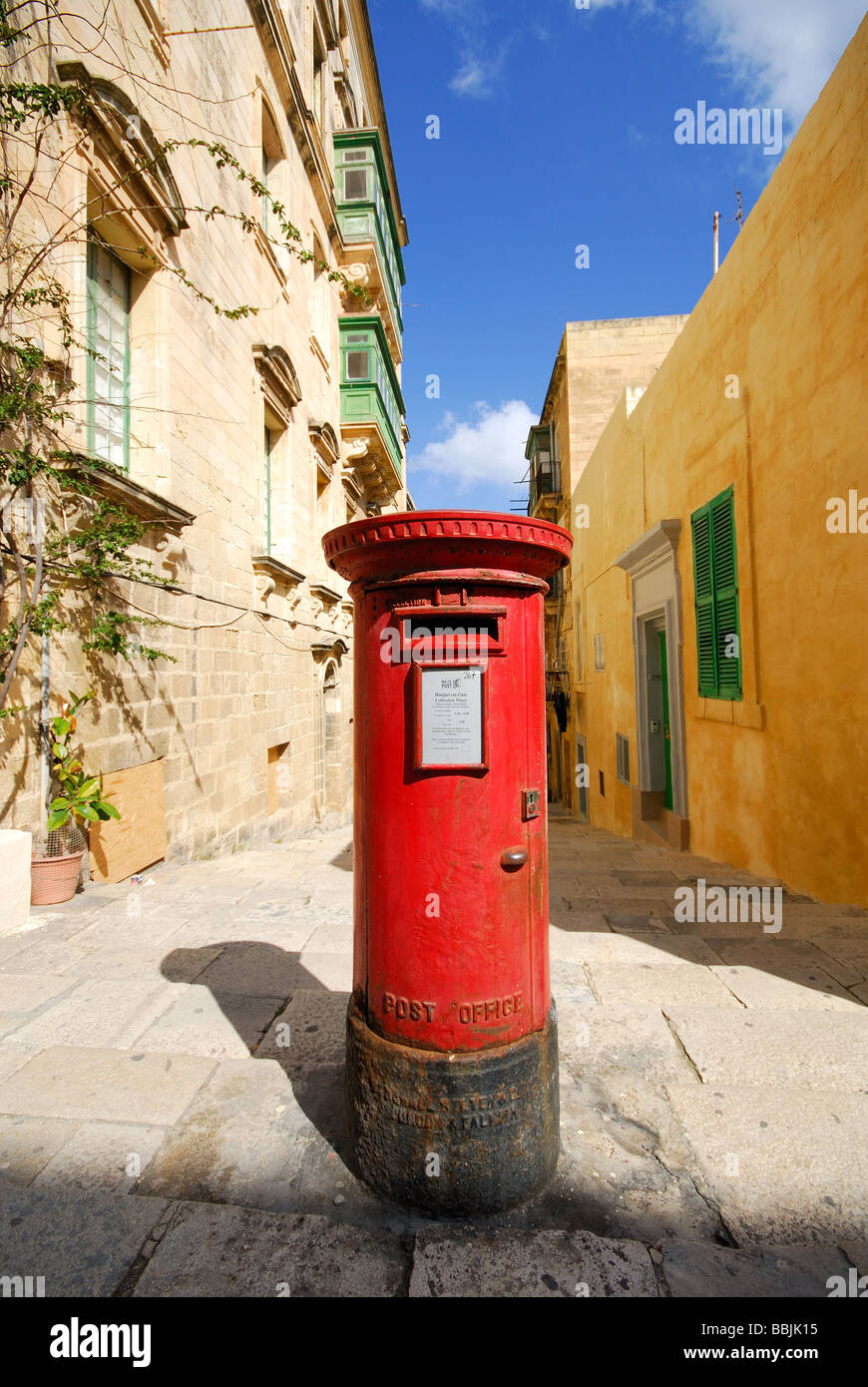 Red british post box in a city street hi-res stock photography and ...