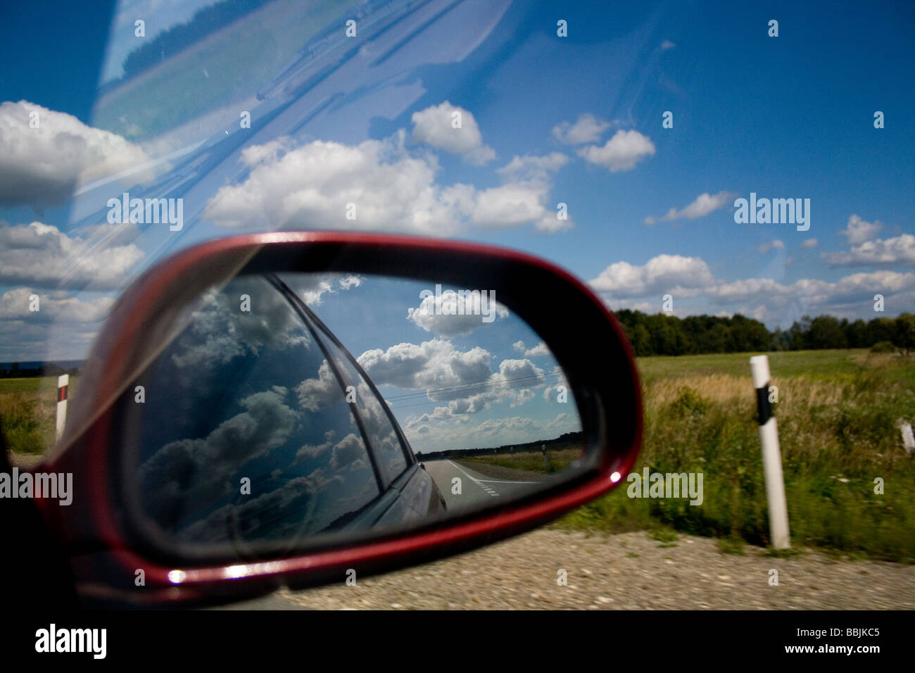 Clouds in a car mirror Stock Photo - Alamy