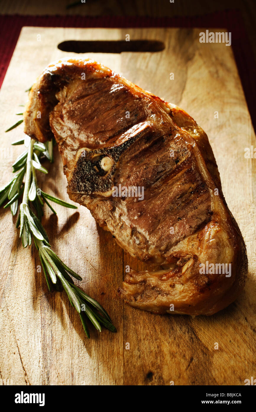 Grilled Barnsley Lamb Chop with Rosemary on board Stock Photo - Alamy
