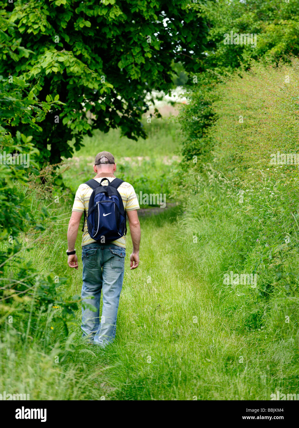 Man walking in the countryside Stock Photo - Alamy
