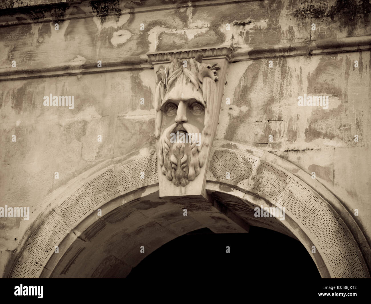 Engraved face on building in Mumbai India Stock Photo - Alamy