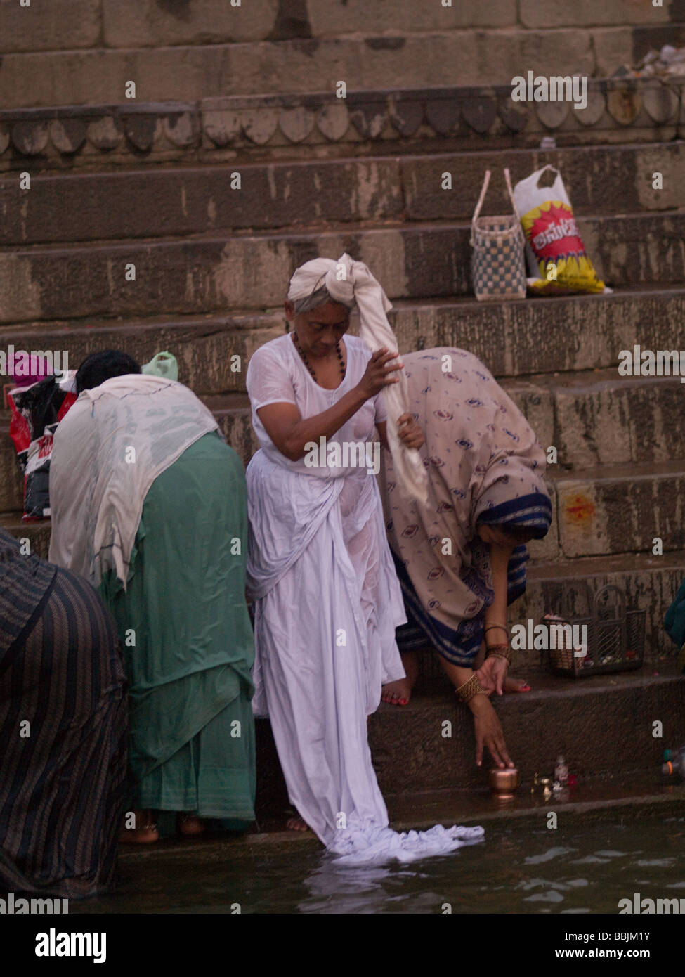 Woman at the edge of the Ganges River in India Stock Photo - Alamy
