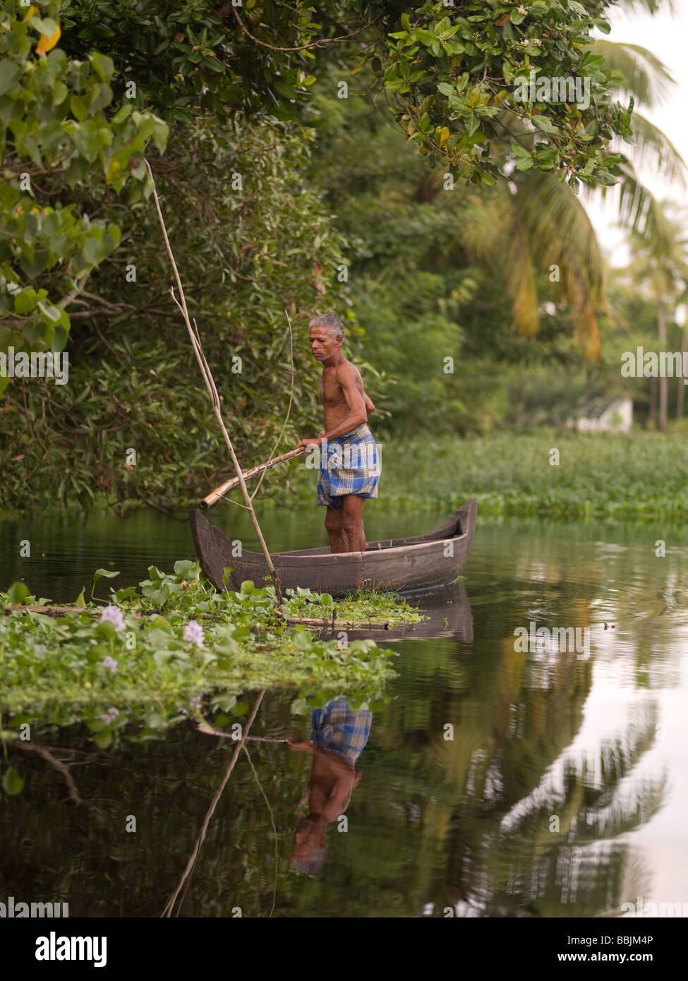 Man standing in a small boat hi-res stock photography and images - Alamy