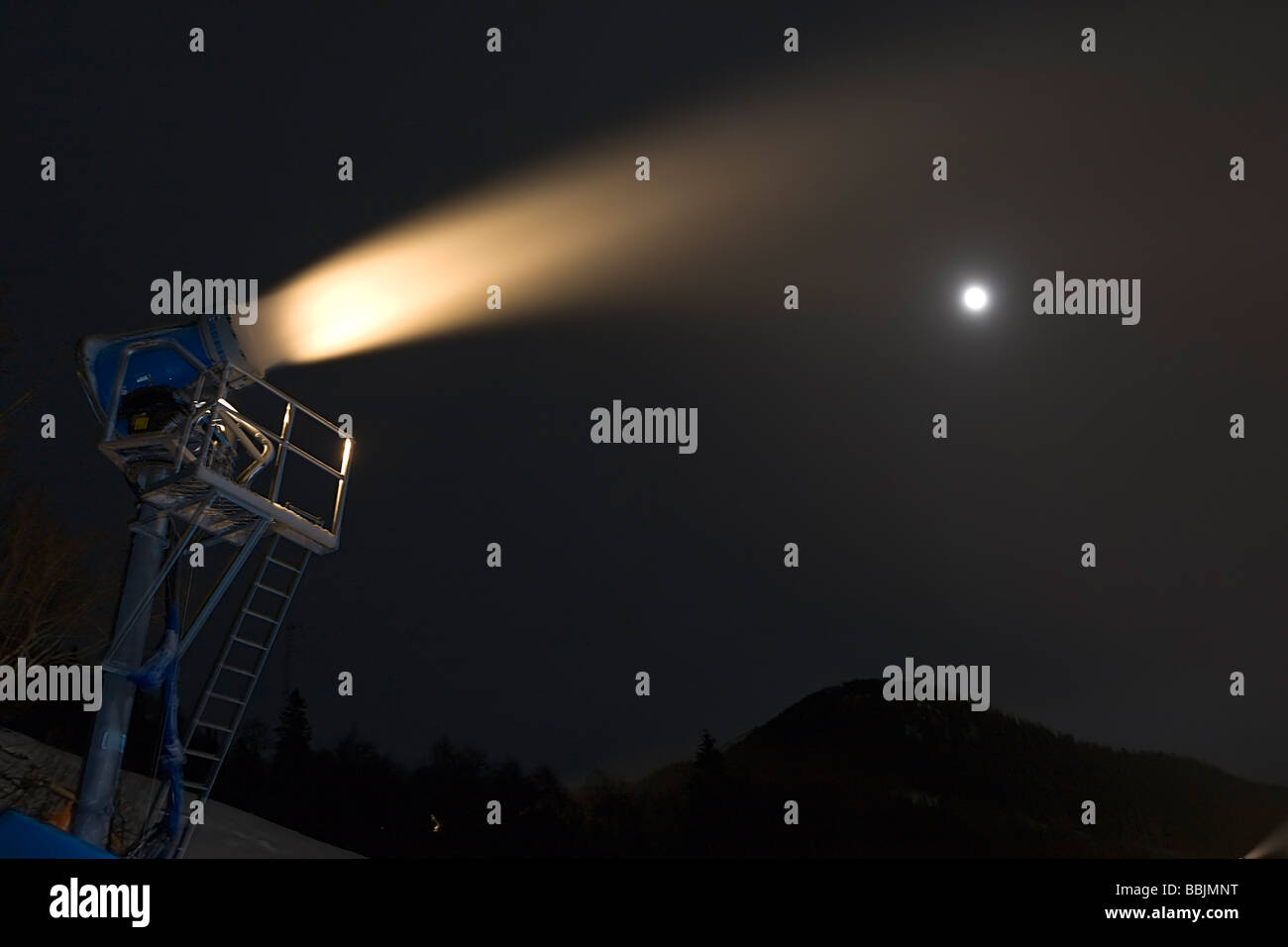 snow generator as searchlight of light at night sky background Stock ...