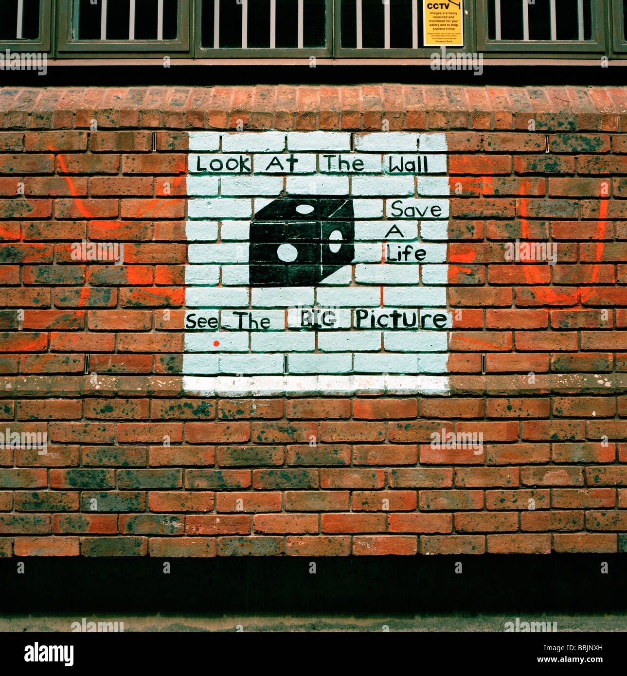 Cryptic graffiti reading "Look at the wall save a life see the big ...