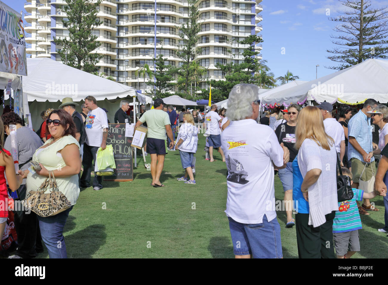 Crowds touring beachside fair with hot rod theme Stock Photo - Alamy