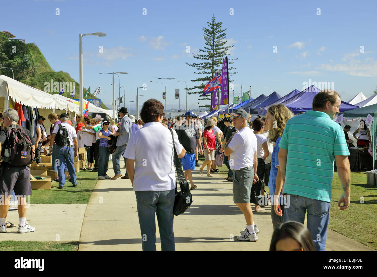 Crowds touring beachside fair with hot rod theme Stock Photo - Alamy