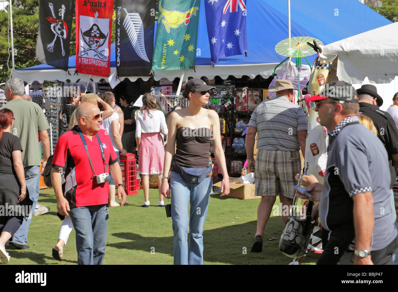 Crowds touring beachside fair with hot rod theme Stock Photo - Alamy