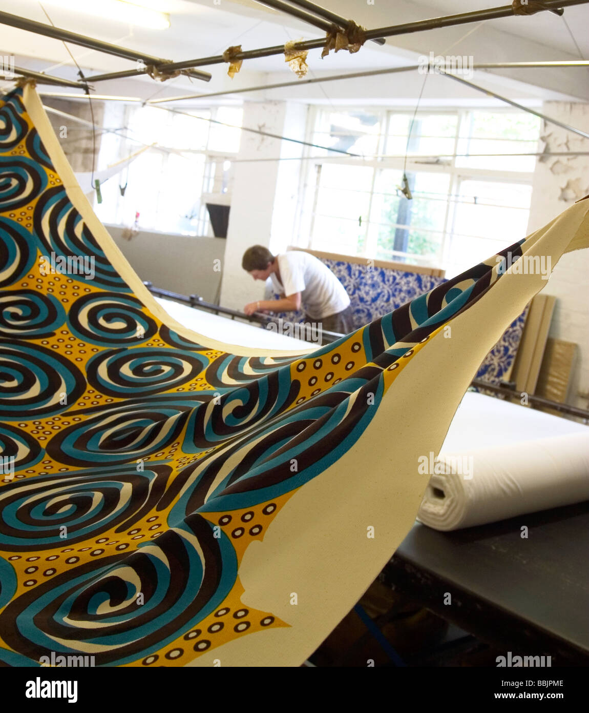 two workers screen printing in workshop creative materials pattern ...