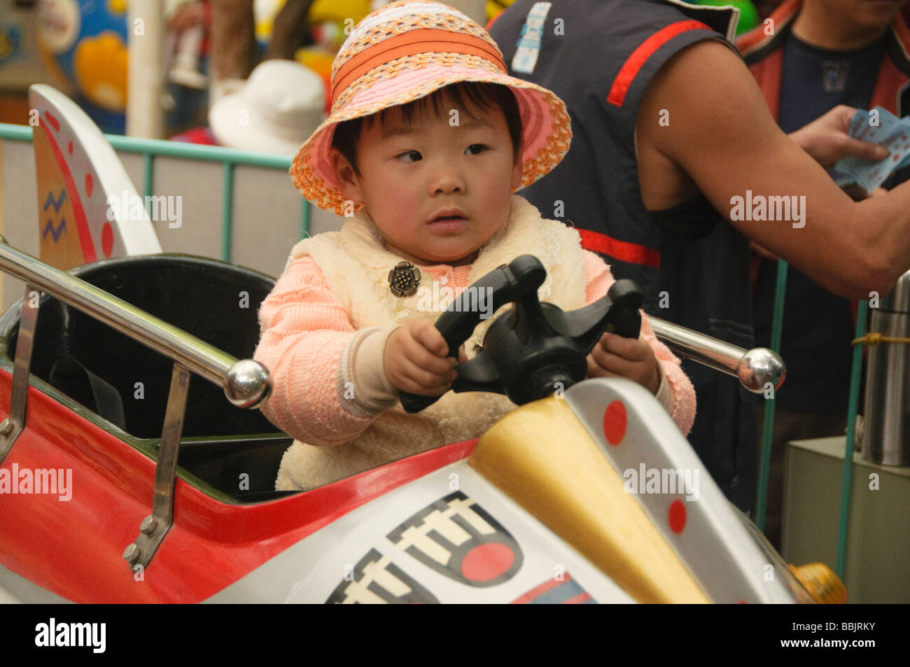 Girl riding a toy car hi-res stock photography and images - Alamy