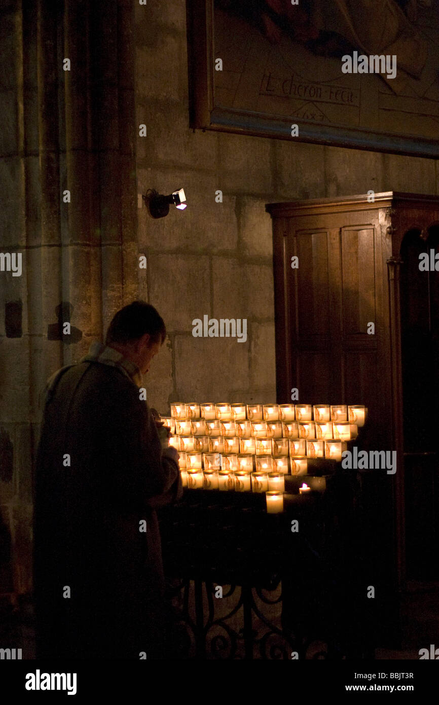 Man lighting a candle hi-res stock photography and images - Alamy