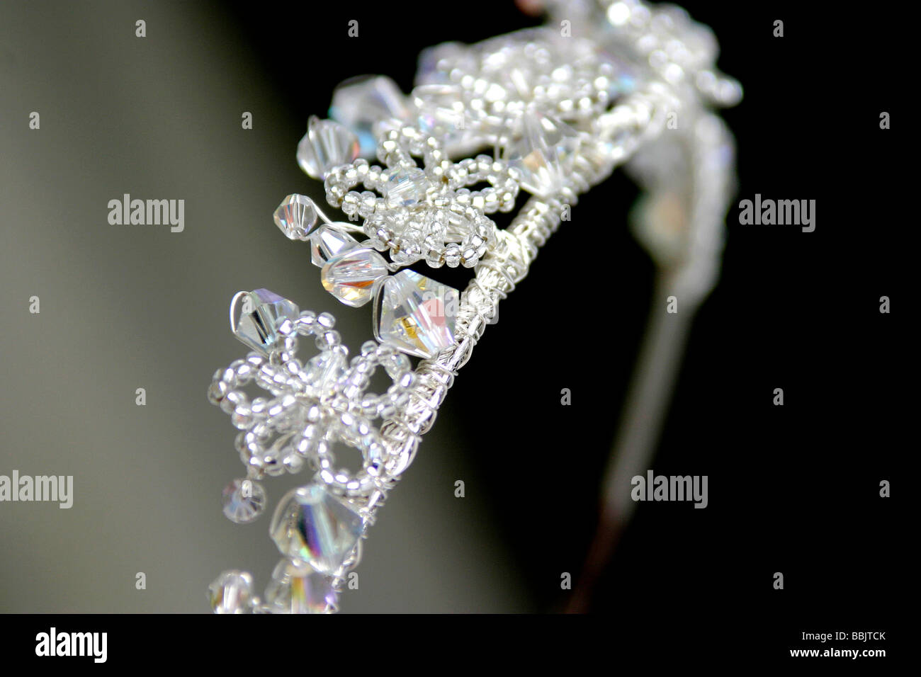 A bride's sparkly jewelled tiara on a black and grey background Stock ...