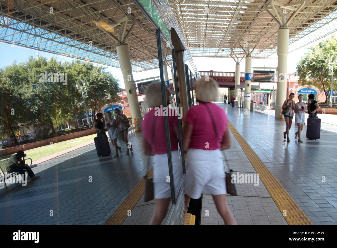 Woman boarding a train at Perth rail station Western Australia Stock ...