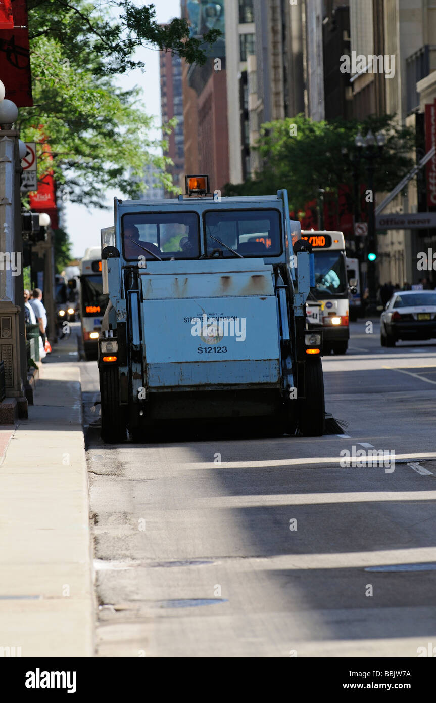 Mechanical road sweeper machine sweeping the gutters of Sate Street ...