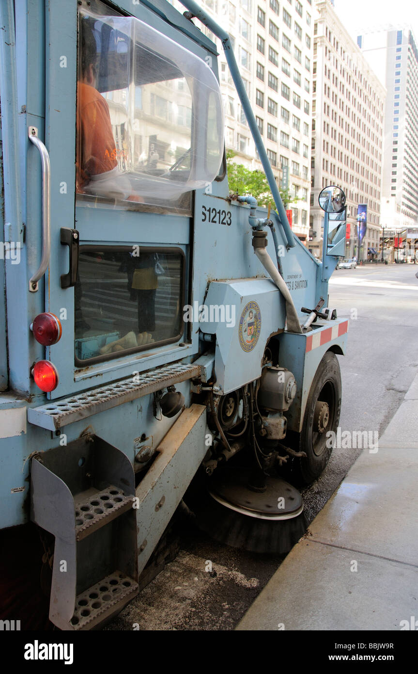 Mechanical road sweeper machine sweeping the gutters of Sate Street ...