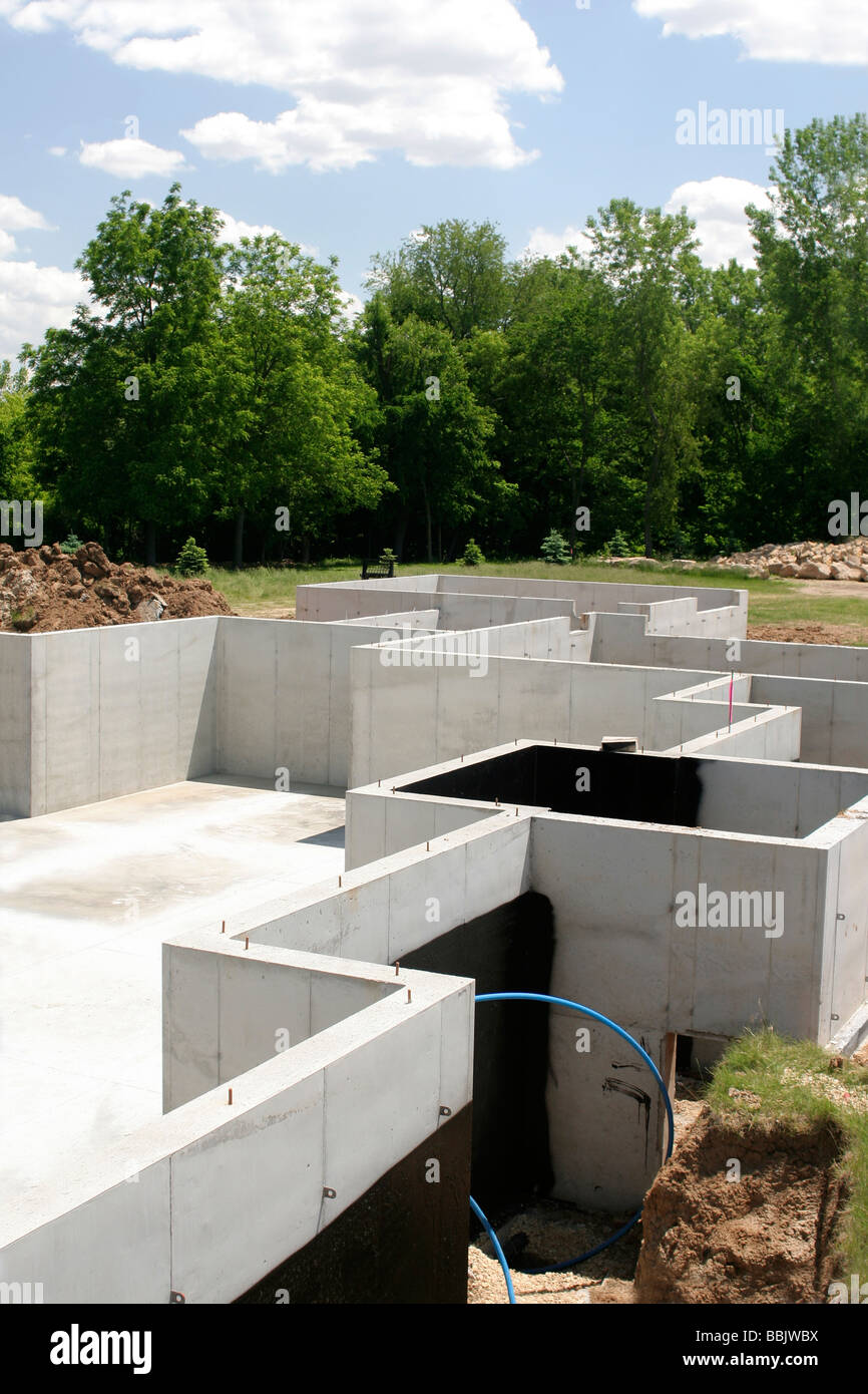 Complex of poured basement walls on new home construction Stock Photo ...