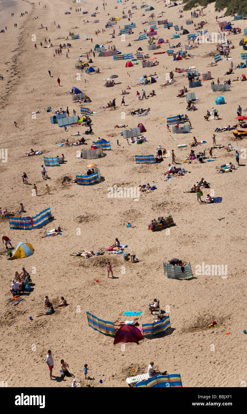 Sun bathers on the South beach at Tenby in Pembrokeshire, South Wales ...