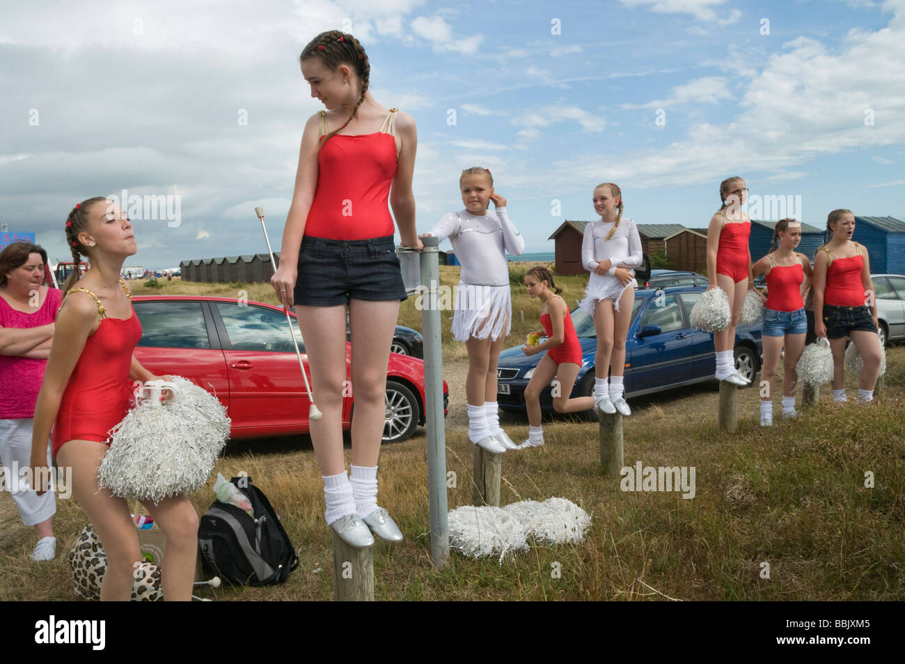 Majorettes pose on posts in red and white costumes, Hayling Island ...