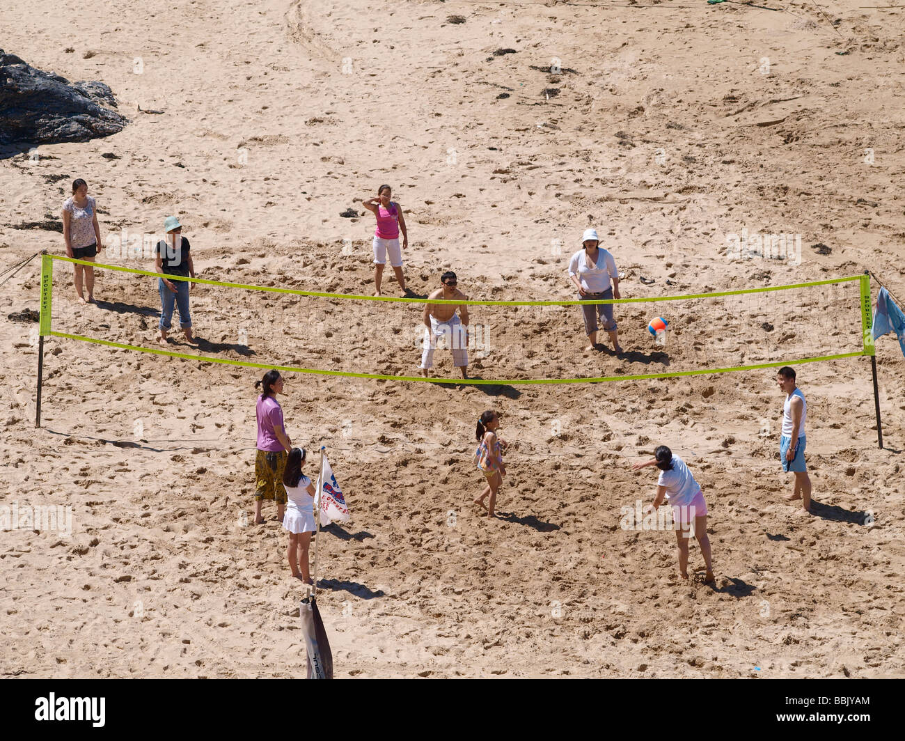 Group kids playing beach volleyball hi-res stock photography and images ...
