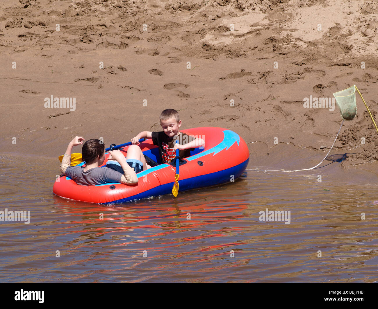 Children playing in inflatable boat hi-res stock photography and images ...