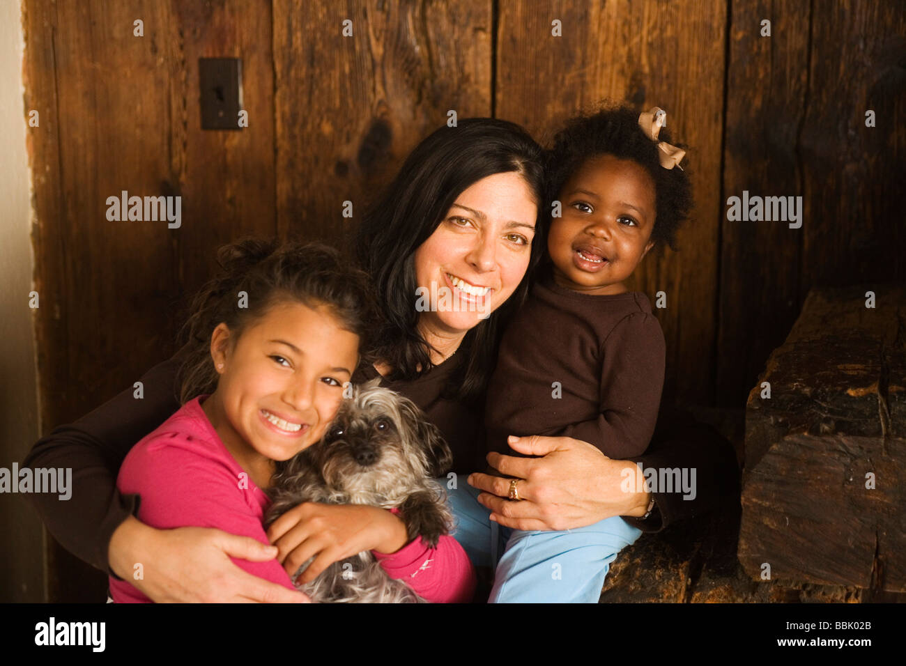 Mother with Adopted Children Stock Photo - Alamy