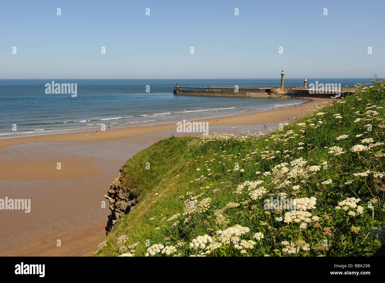 A view of the harbour entrance and beach at Whitby Stock Photo - Alamy
