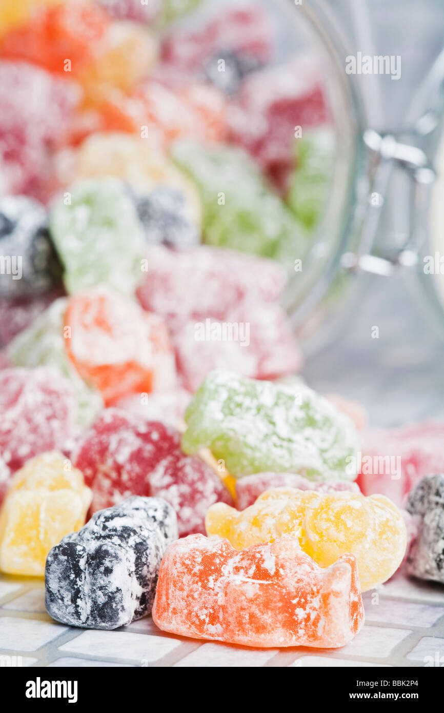 Jelly babbies falling out of a jar Stock Photo - Alamy