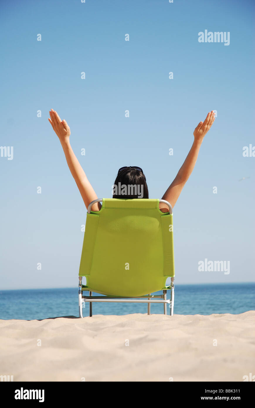 Young lady sunbathing on a deckchair Stock Photo - Alamy