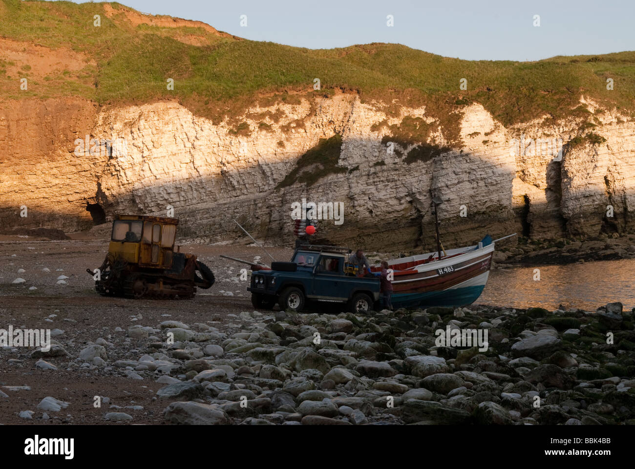 Launching a small fishing boat Stock Photo - Alamy