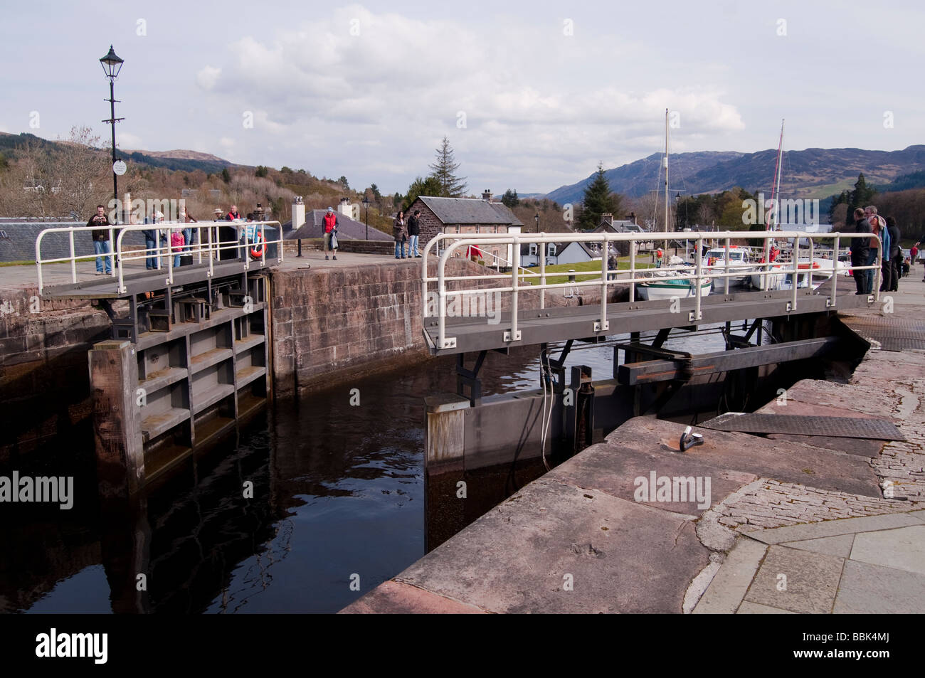Lock doors opening on the Caledonian Canal in Fort Augustus Stock Photo ...