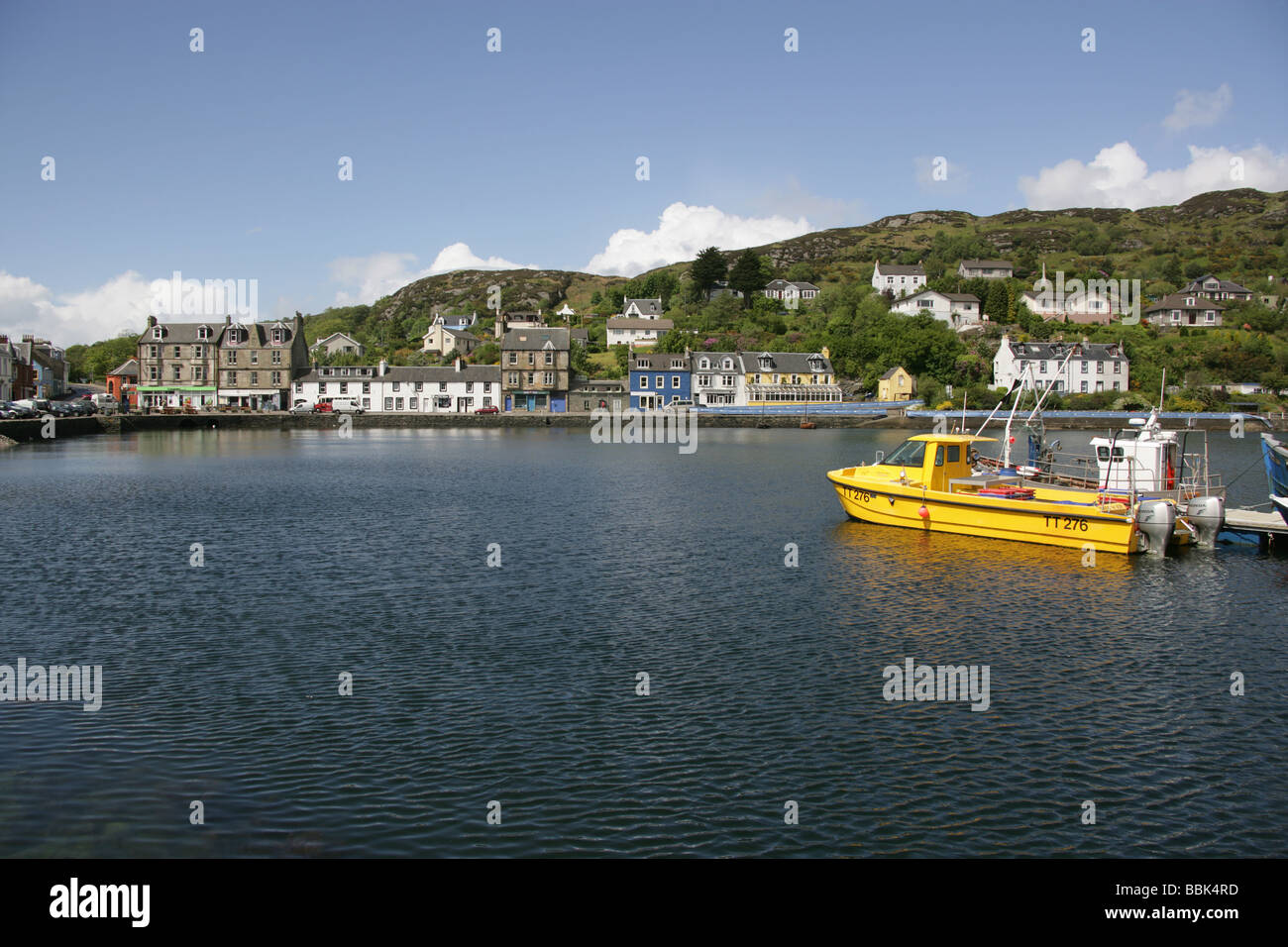 Village of Tarbert, Scotland. Fishing boats berthed in Tarbert harbour ...