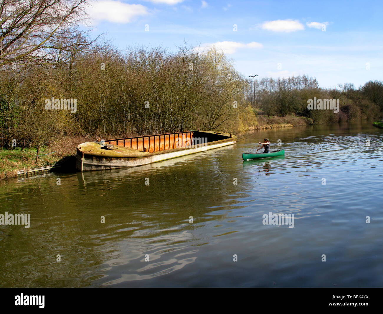 A Canoist passing alongside a British Waterways Barge on the Grand ...