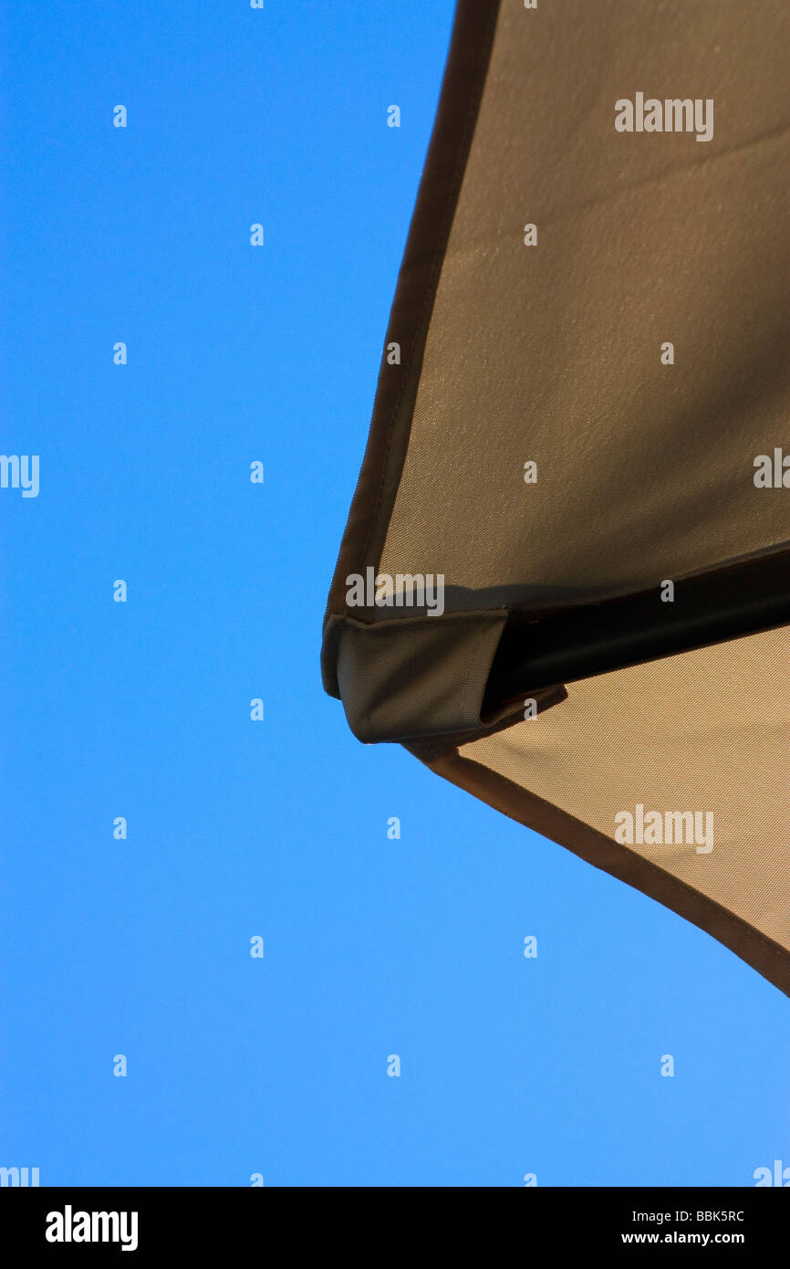 Corner of a Parasol against blue sky Stock Photo - Alamy