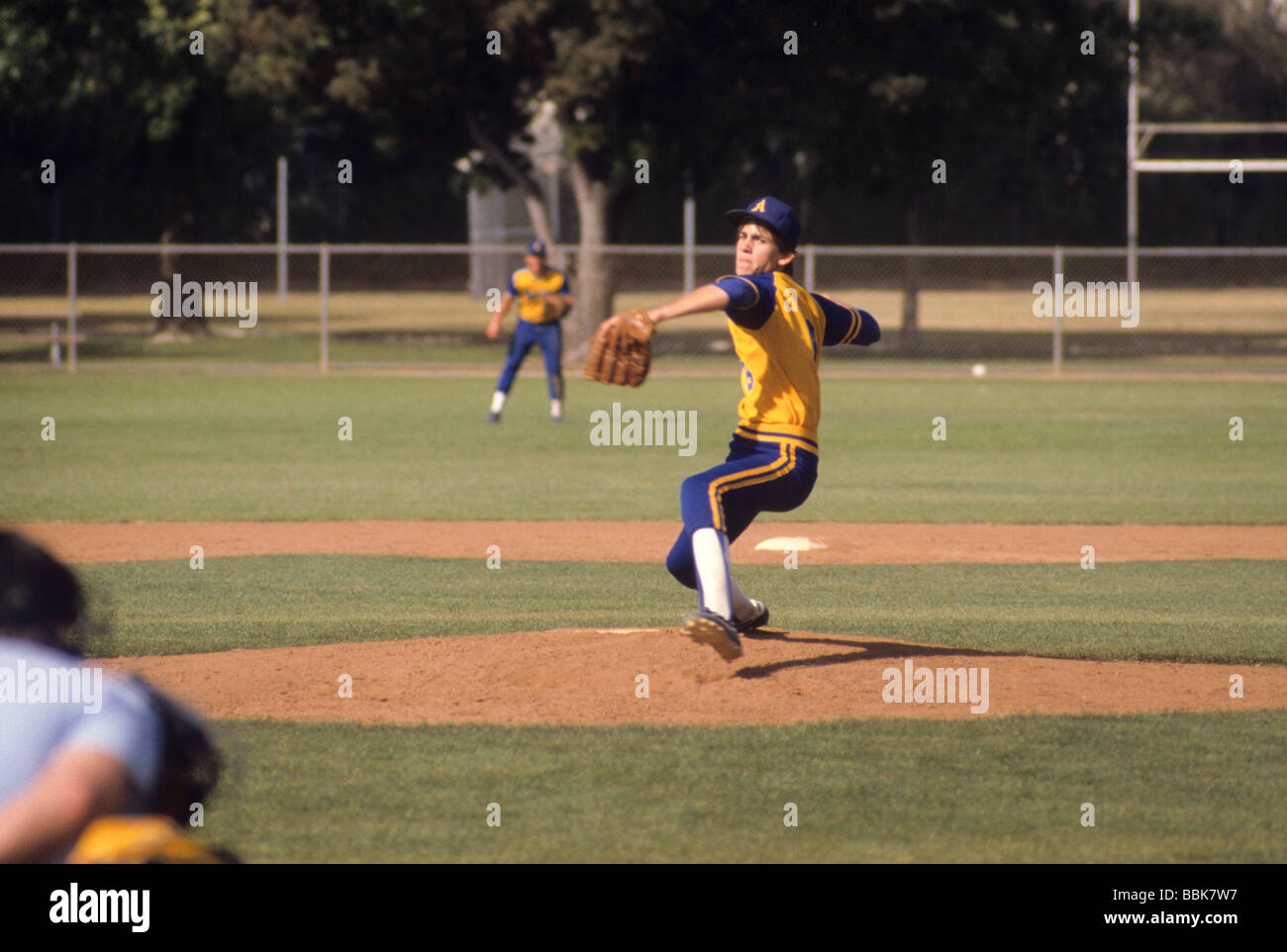 teen boy pitcher baseball sport effort strain try hard throw Stock ...