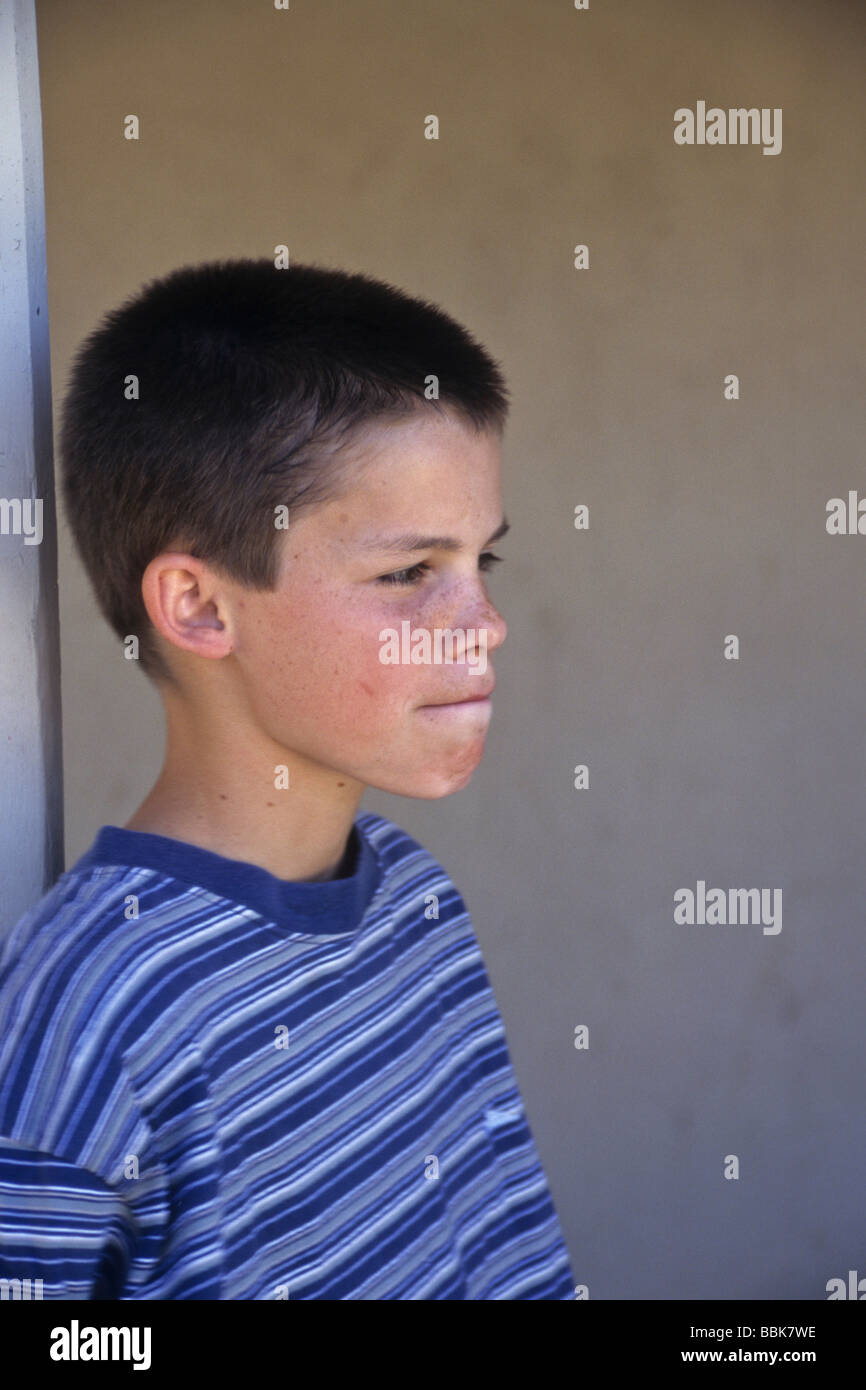 young boy serious expression face concentrate sincere intent emotion ...