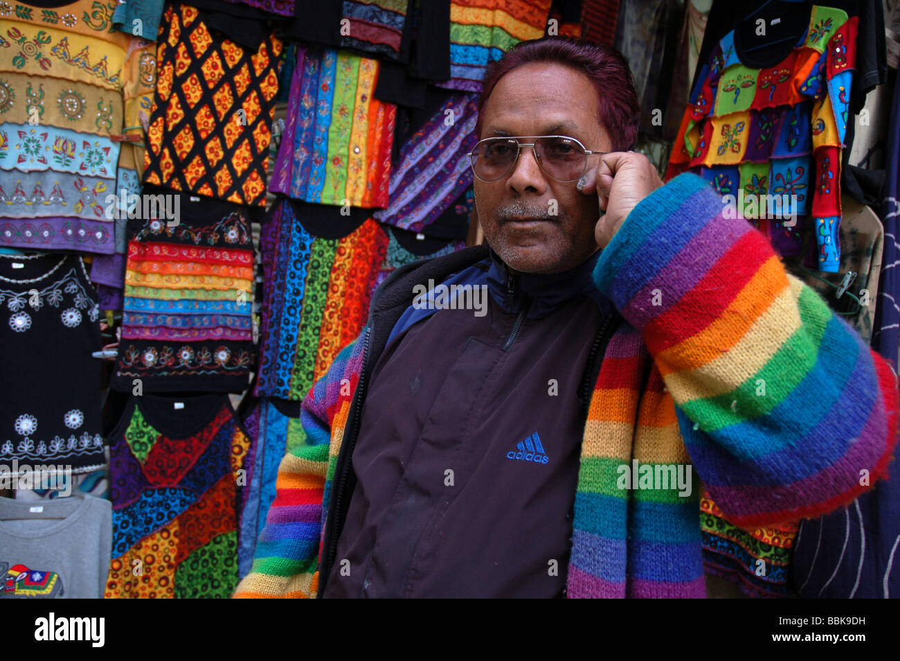 Shopkeeper selling clothes in Kathmandu, NEPAL Stock Photo - Alamy