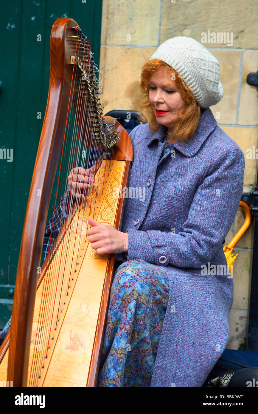 Woman playing harp hi-res stock photography and images - Alamy