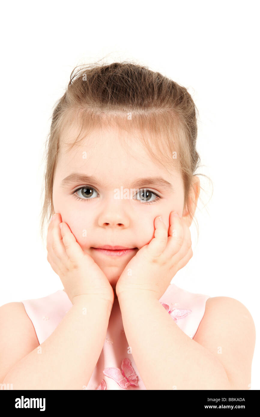 Portrait of young girl with hands on face, studio shot Stock Photo - Alamy