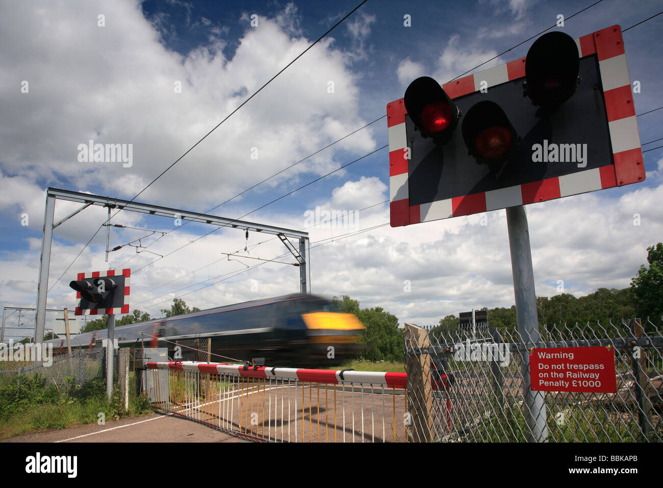 Speeding National Express Train Passing a Level Crossing East Coast ...