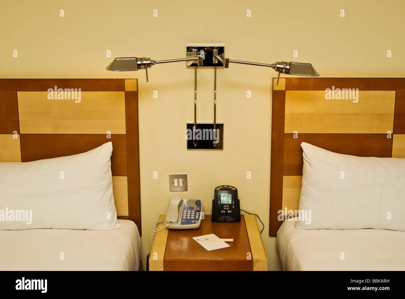 A typical hotel bedside Stock Photo - Alamy