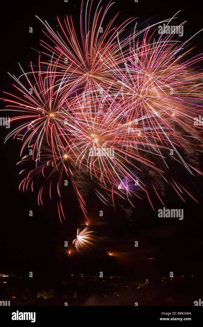 Fireworks by night over a town Stock Photo - Alamy