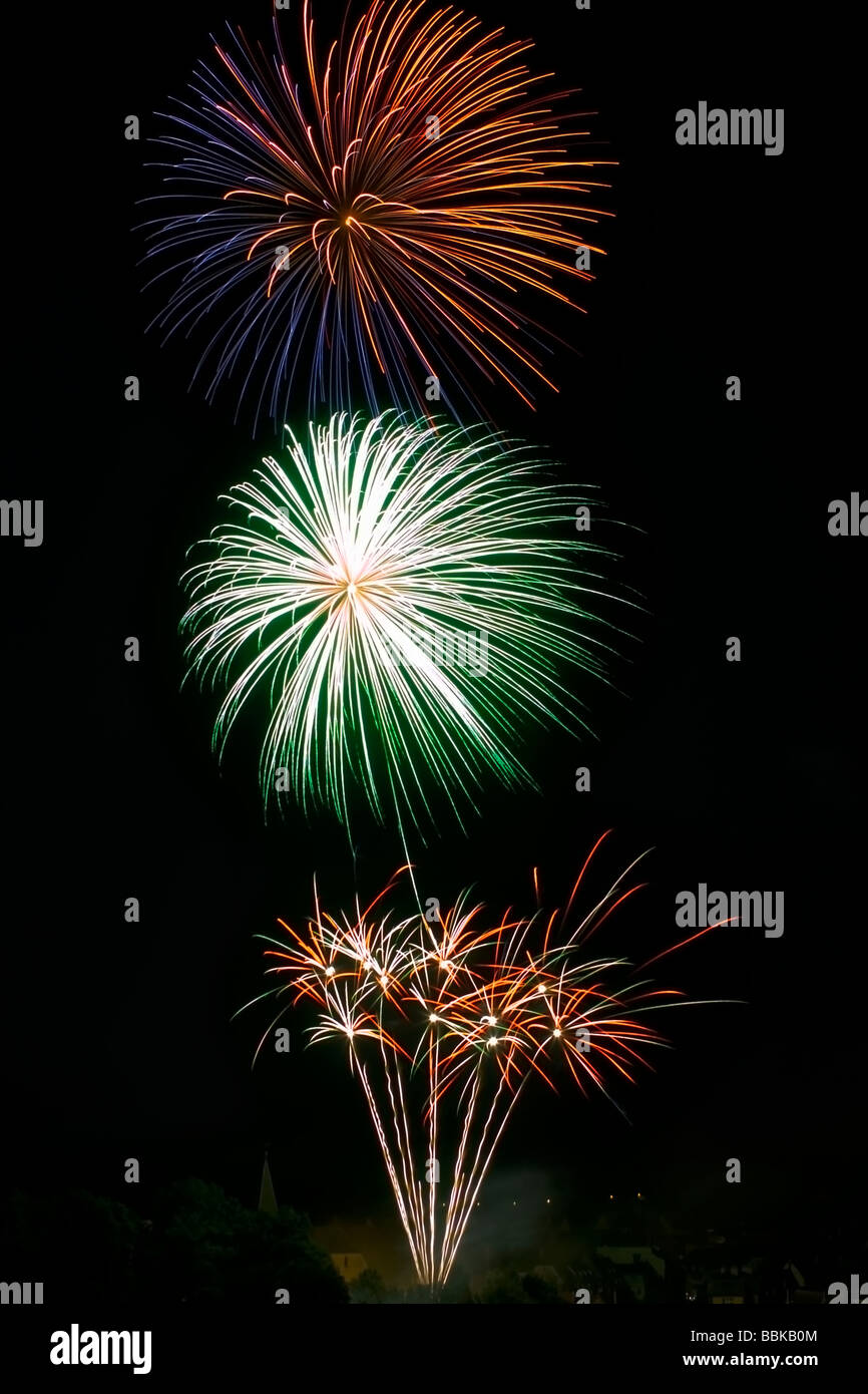Fireworks by night over a town Stock Photo - Alamy