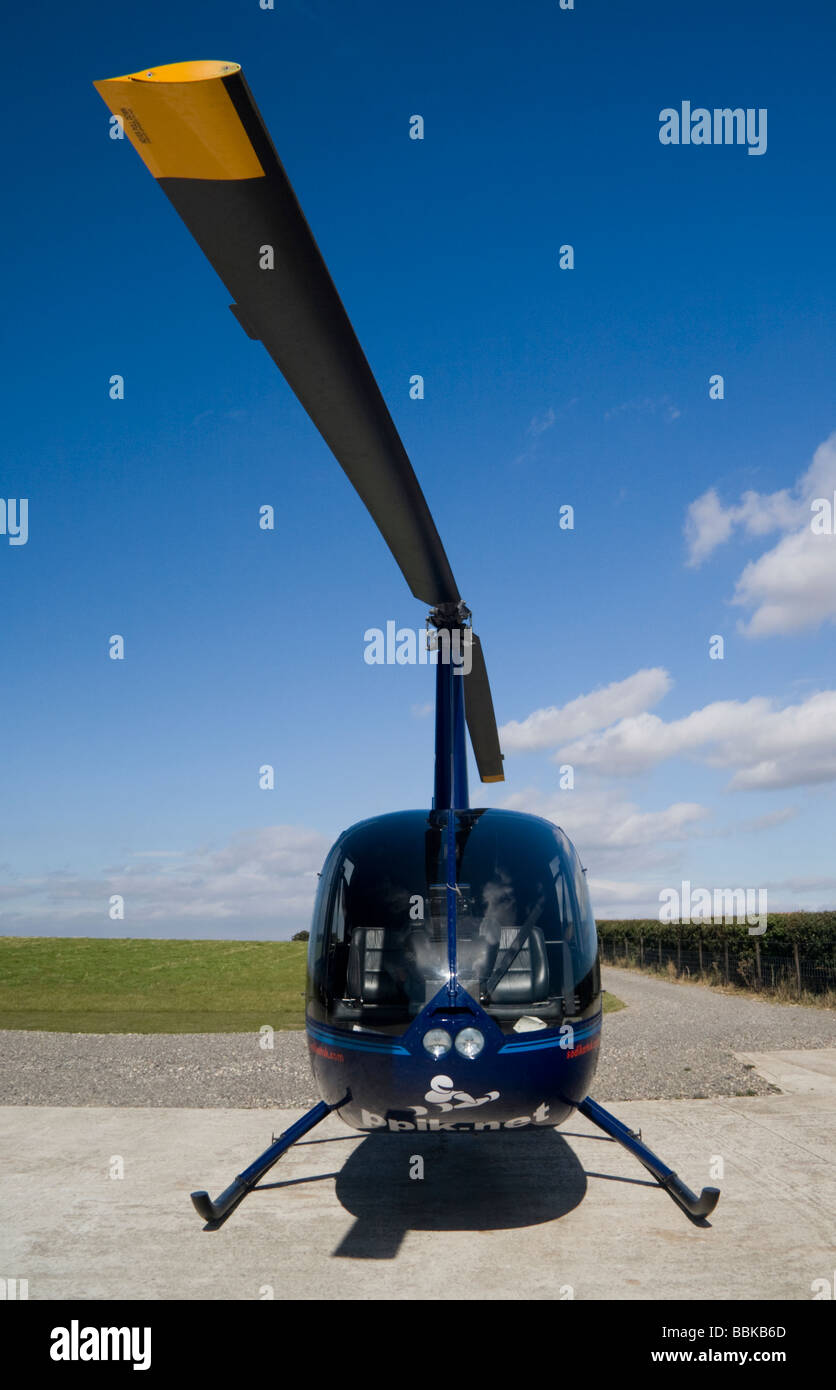 Robinson R44 Helicopter on the ground front view Stock Photo - Alamy