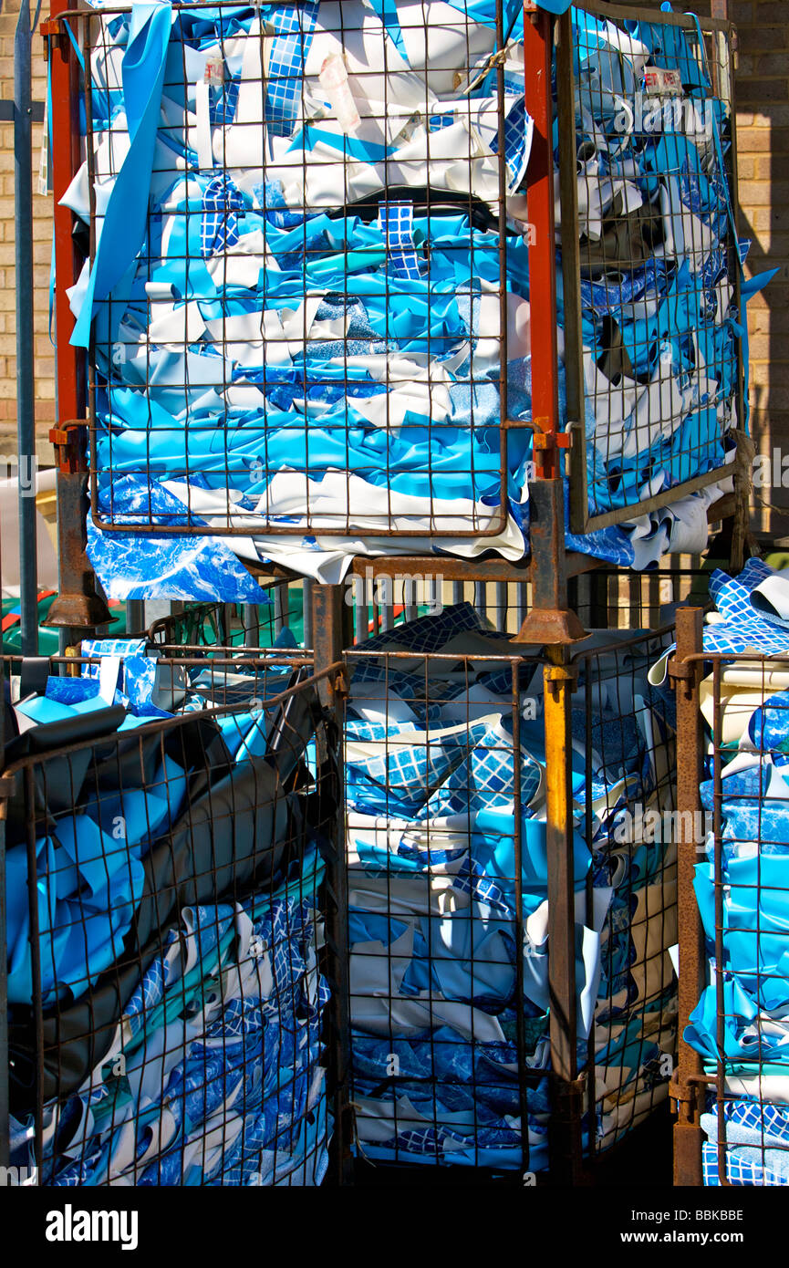 Vinyl off cuts in cages outside of a factory Stock Photo - Alamy