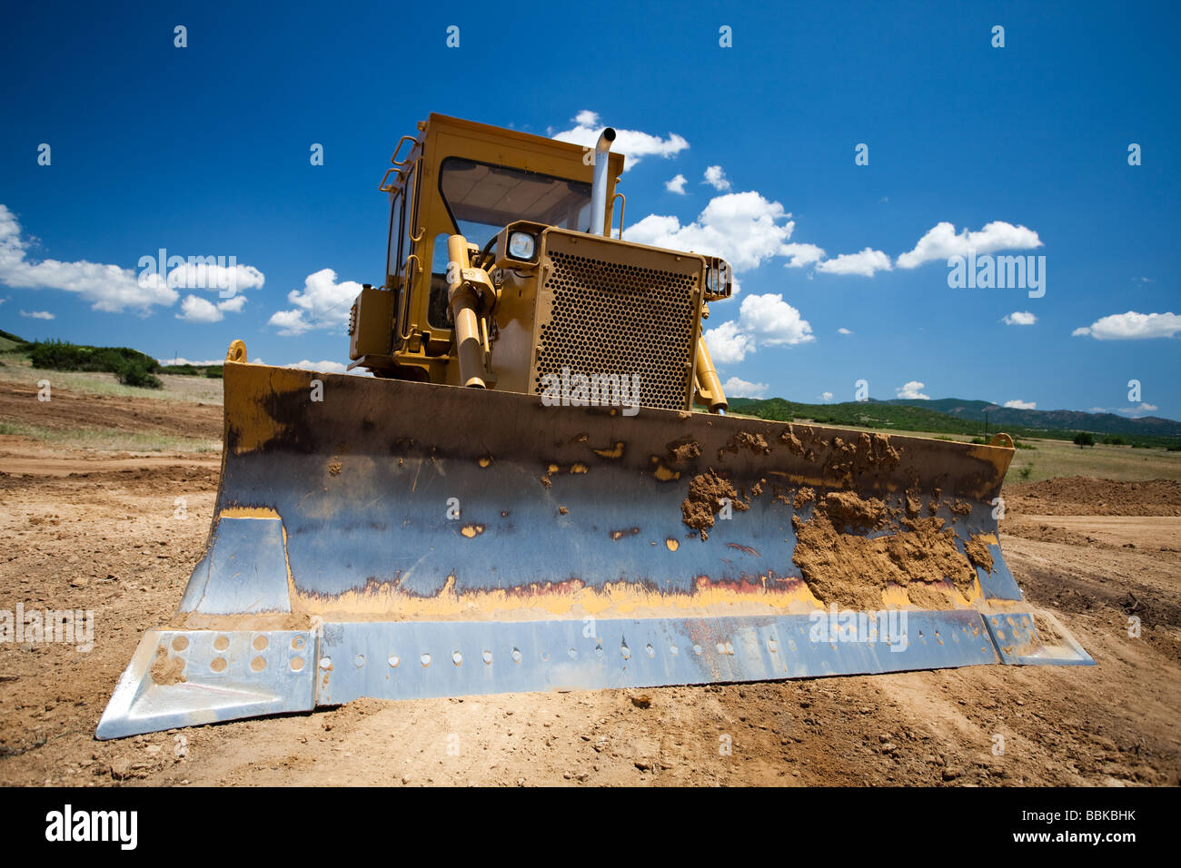 Bulldozer at construction yard Stock Photo - Alamy