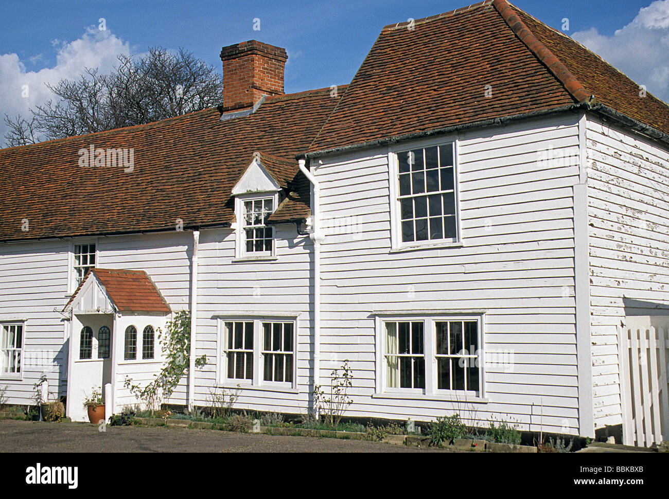 Tillingham, Essex, weather-boarded cottages beside the parish church ...