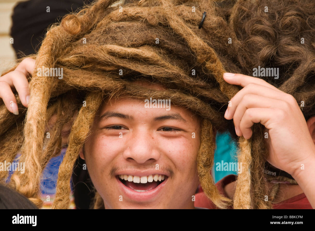 local playing with tourist's dreadlocks in Yuanyang China Stock Photo ...