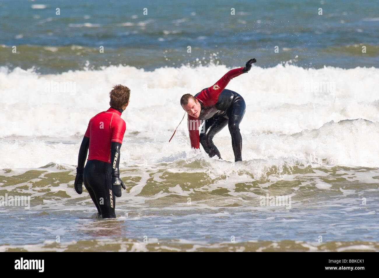 Surfer falling off of surf board hi-res stock photography and images ...