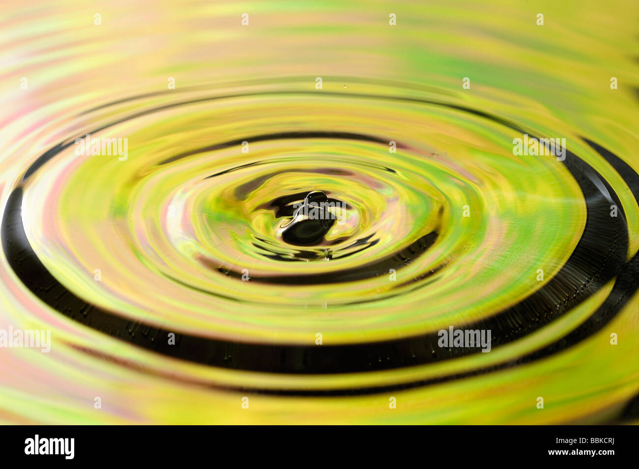 Close up of a water drop hitting a water surface Stock Photo - Alamy
