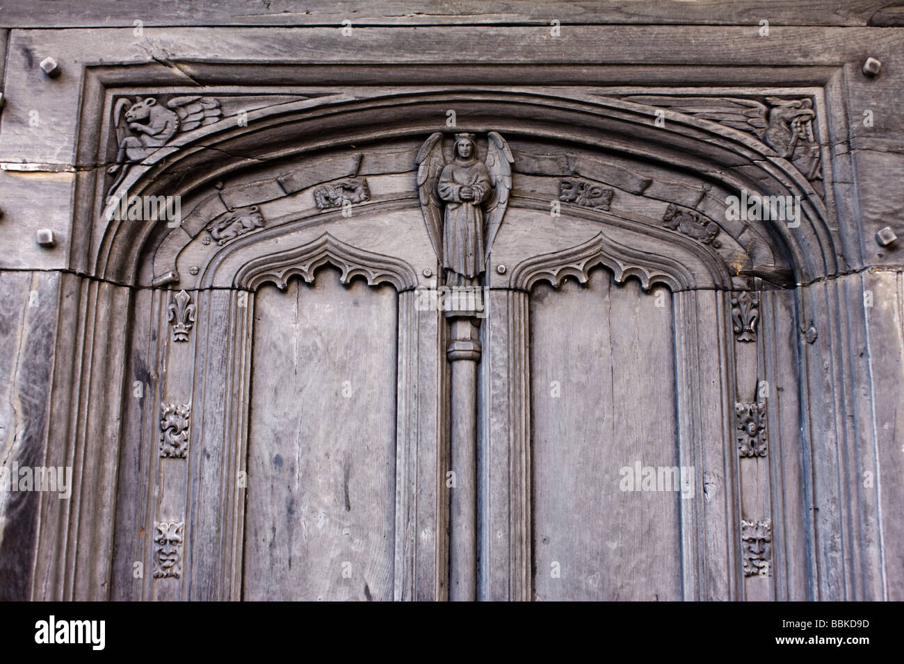 Ornately carved medieval doorway in Tewkesbury town centre ...